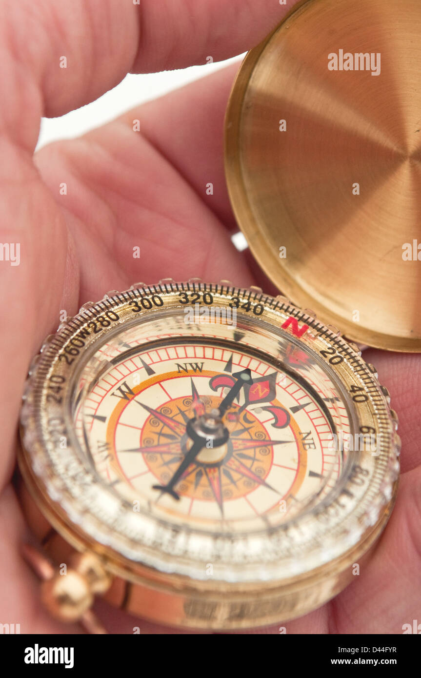 Man holding compass in hand, navigation concept Stock Photo - Alamy