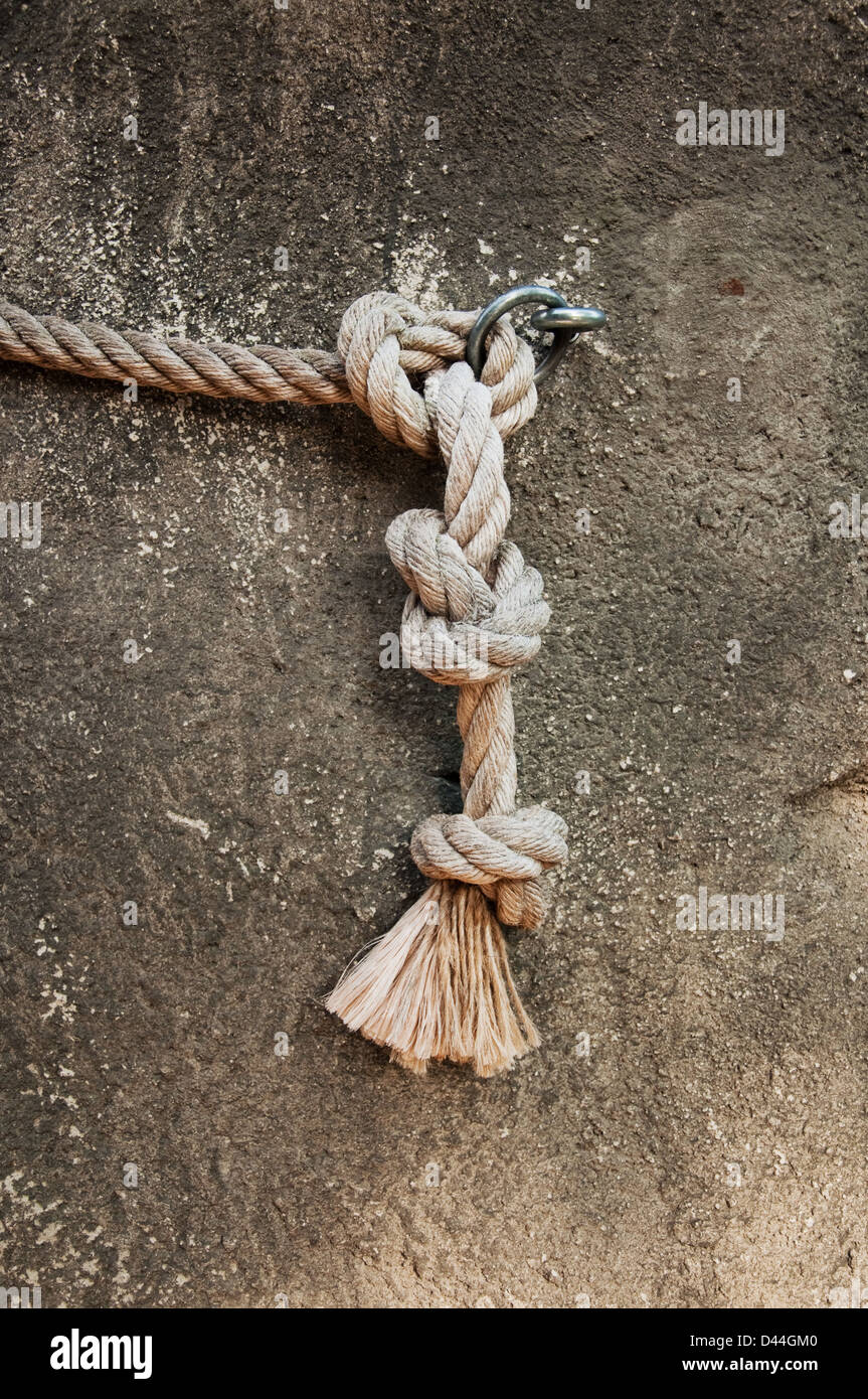 Ship rope and weathered stone background Stock Photo - Alamy