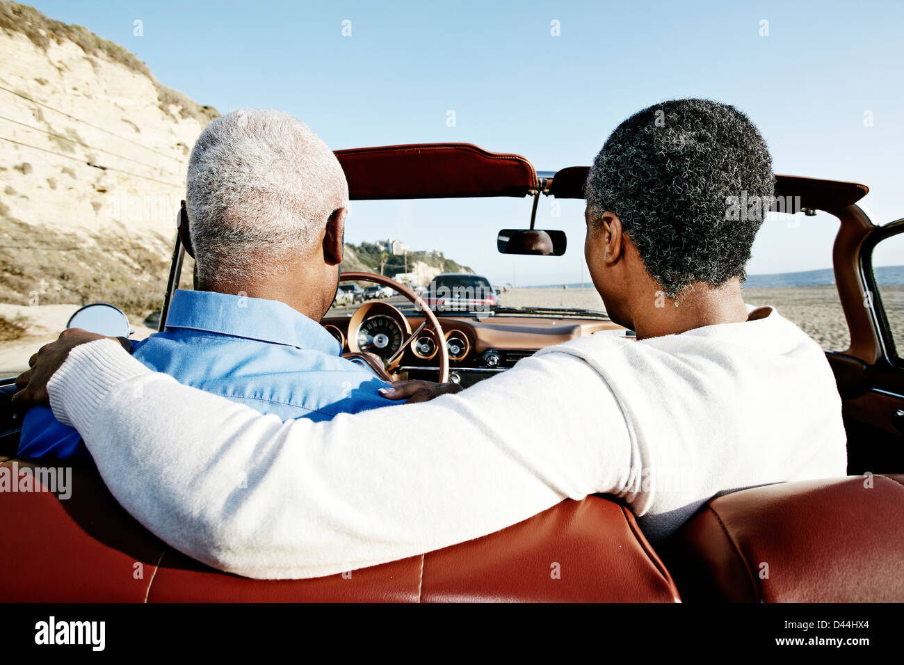 Black couple driving convertible Stock Photo - Alamy