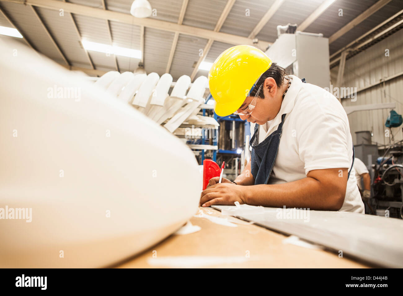 Man working in manufacturing plant Stock Photo - Alamy