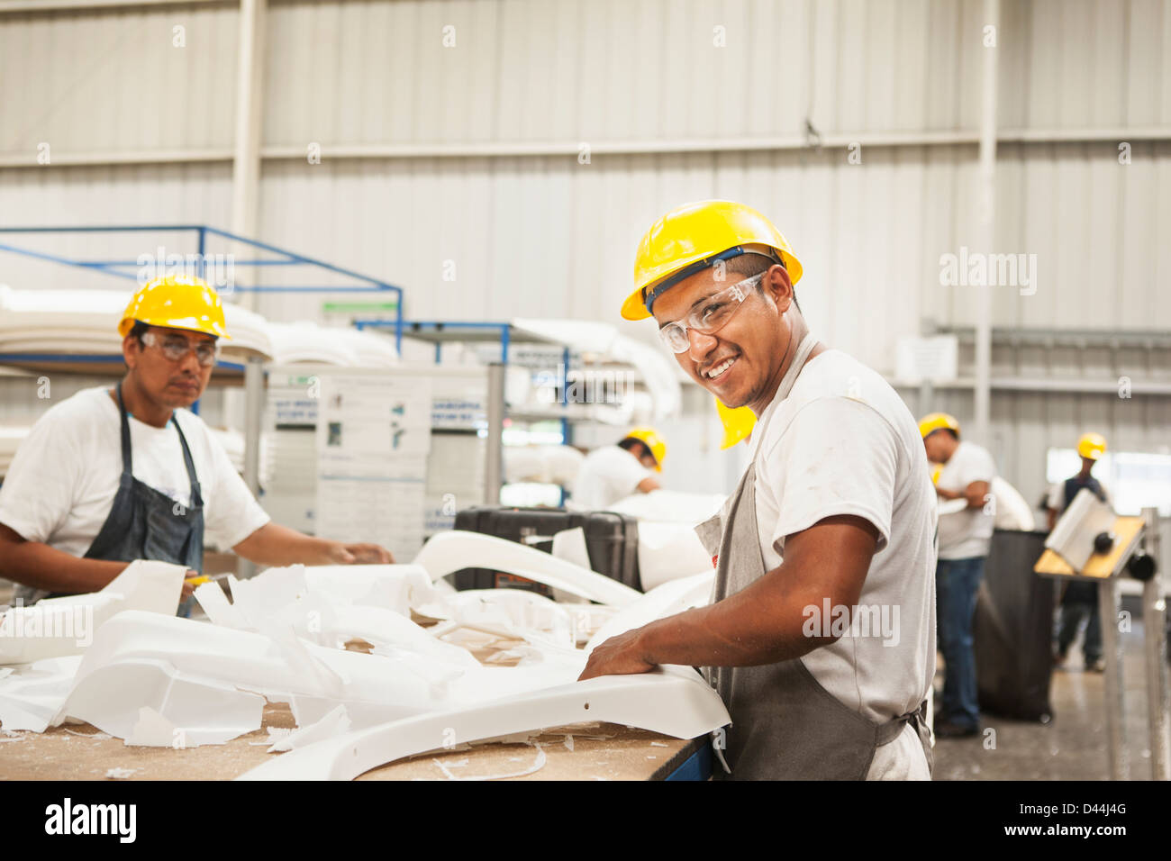 Men working in manufacturing plant Stock Photo - Alamy