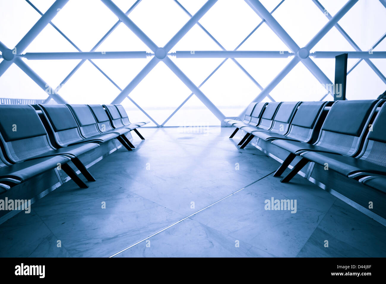 Airport terminal waiting area, blue toned Stock Photo - Alamy