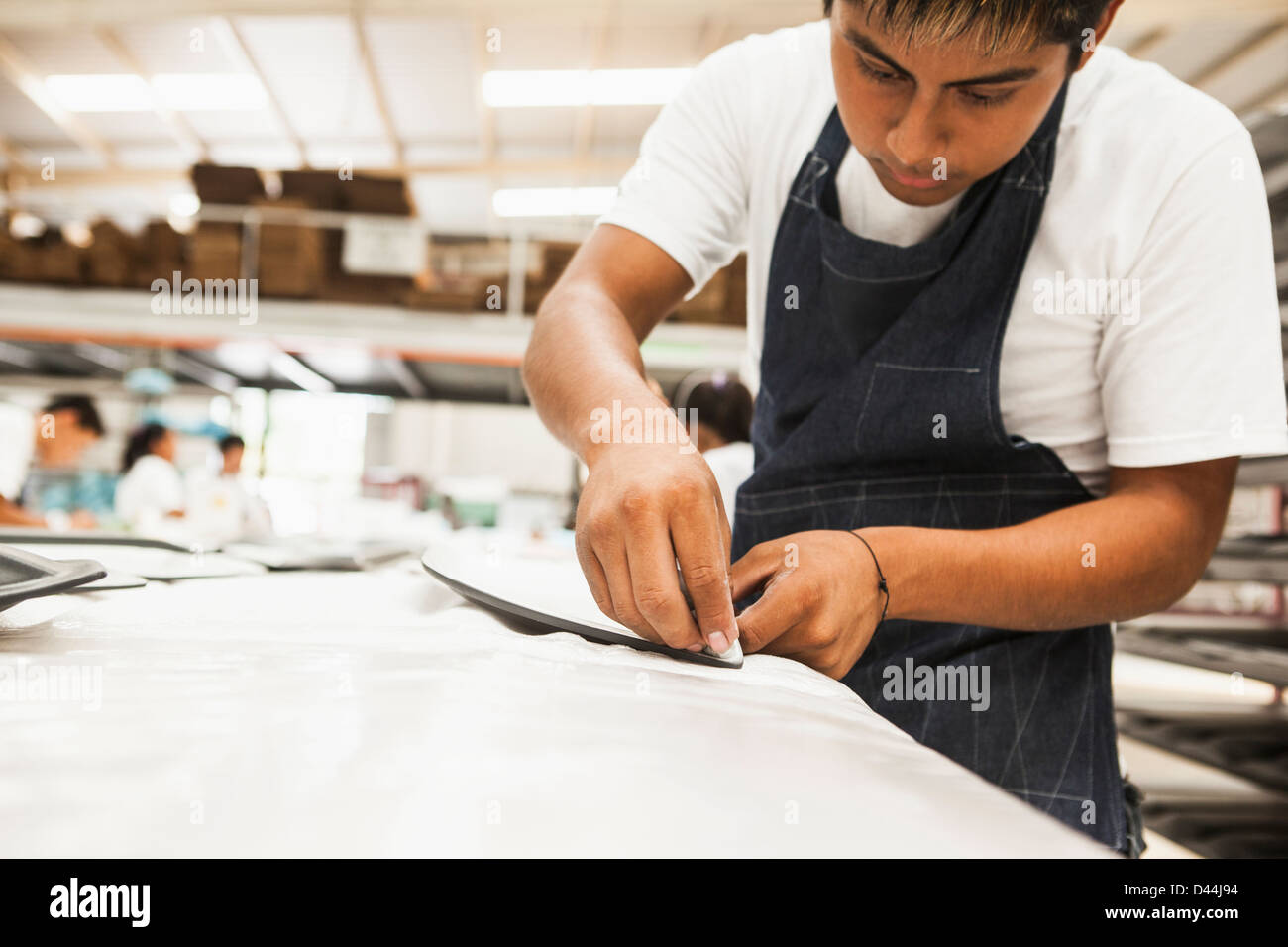 Man working in manufacturing plant Stock Photo - Alamy