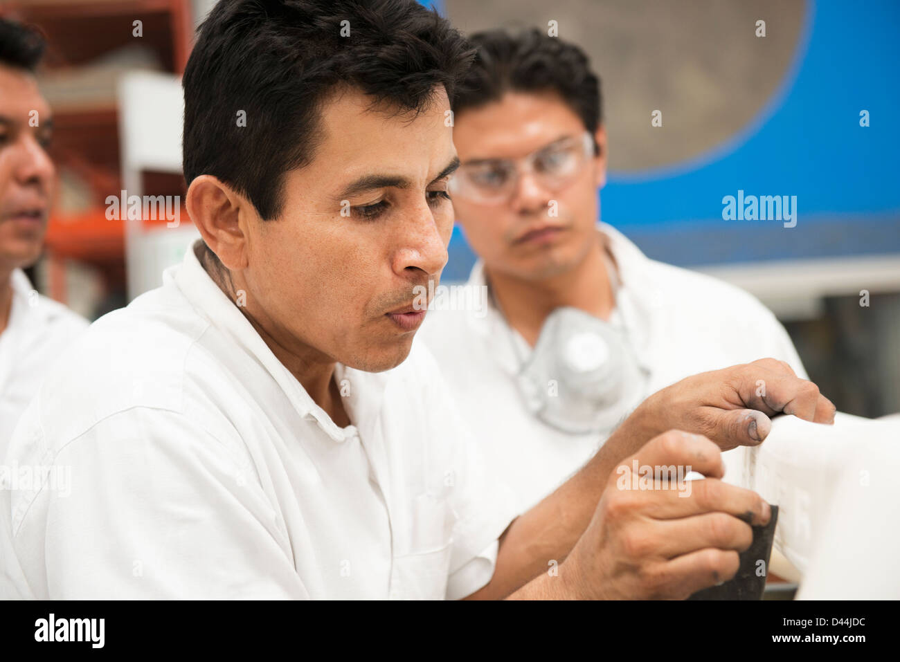 Men working in manufacturing plant Stock Photo - Alamy