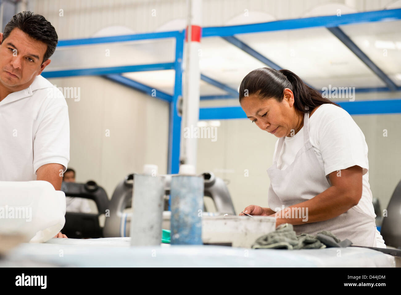 People working in manufacturing plant Stock Photo - Alamy