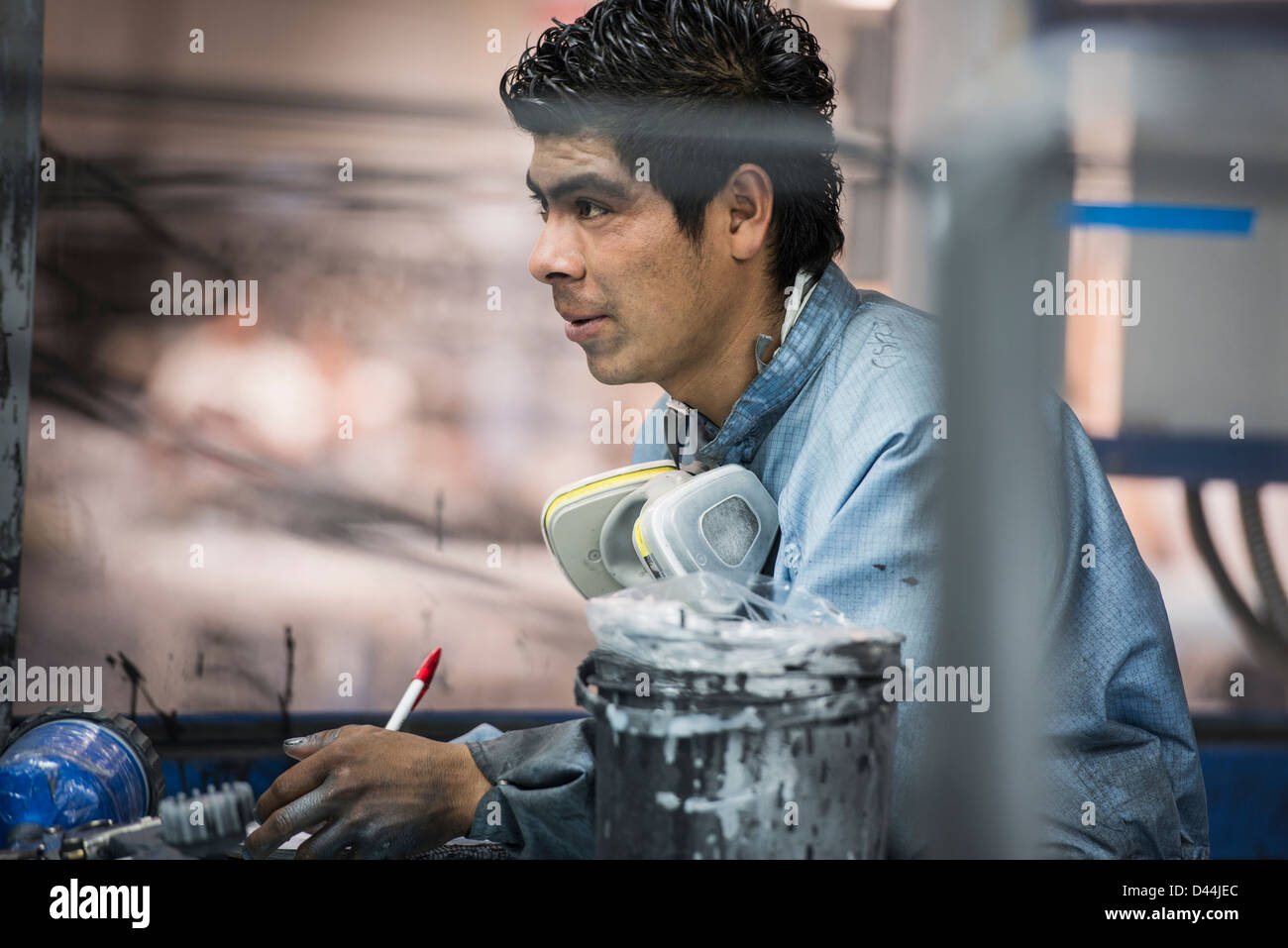Man working in manufacturing plant Stock Photo - Alamy