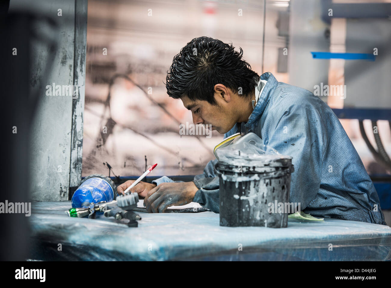 Man working in manufacturing plant Stock Photo - Alamy