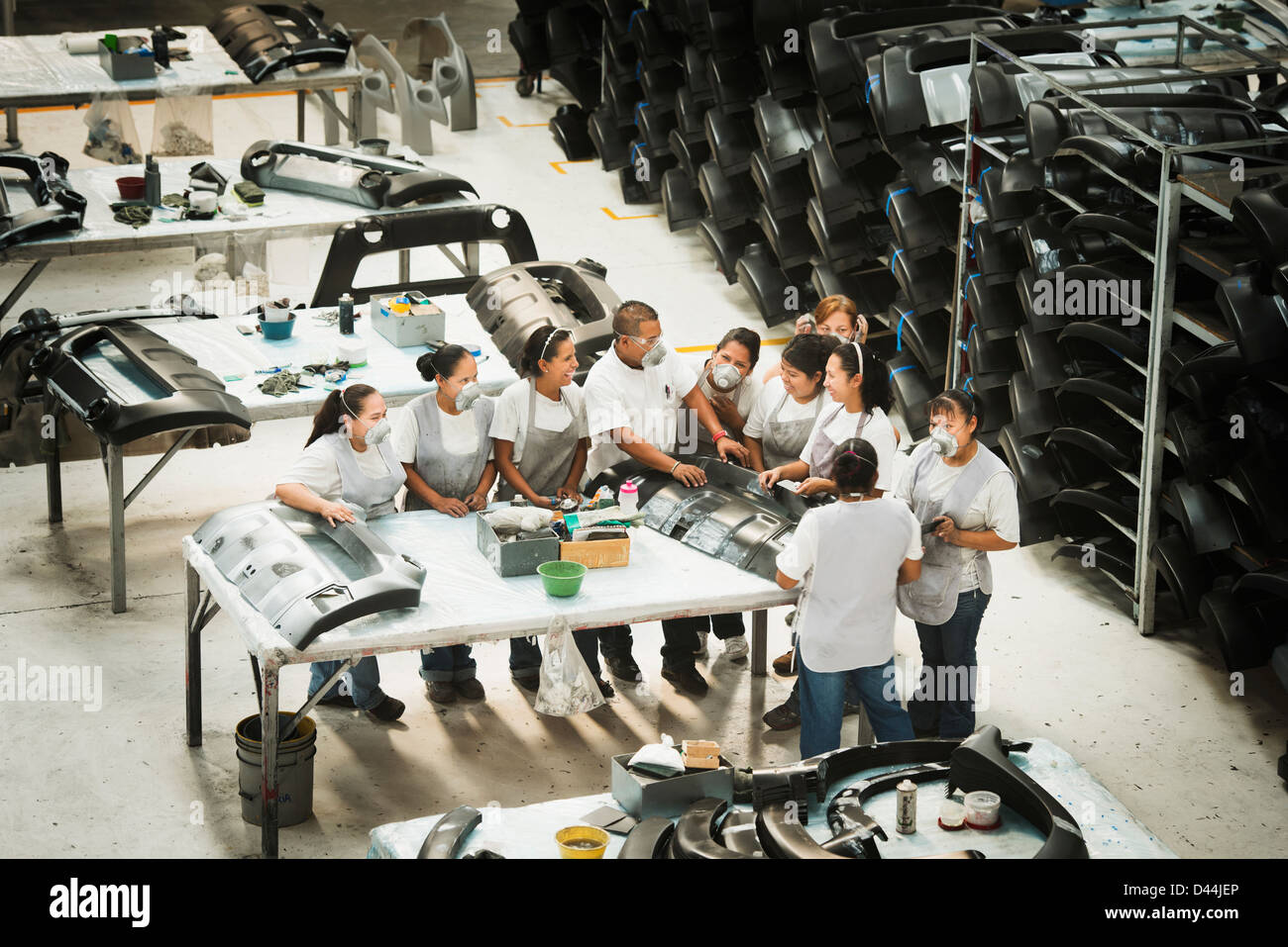 Workers talking in manufacturing plant Stock Photo - Alamy