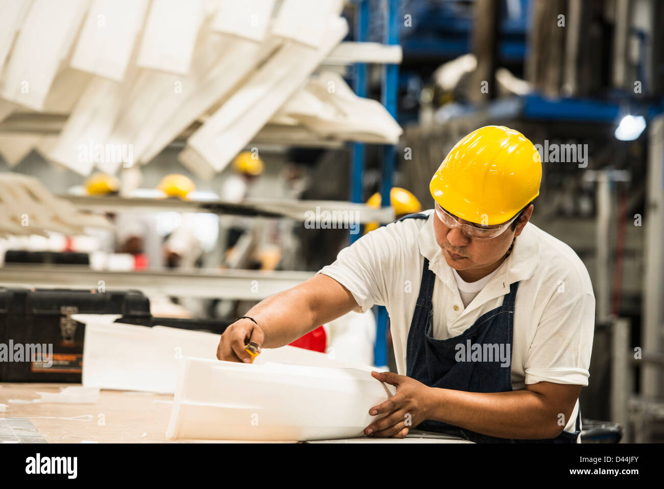 Man working in manufacturing plant Stock Photo - Alamy