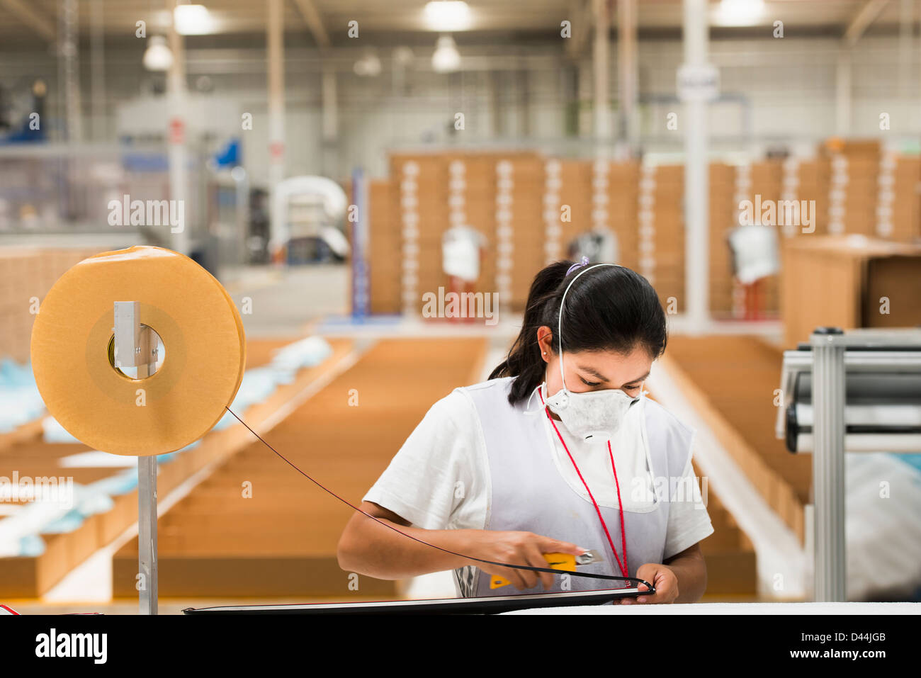 Worker wearing face mask in manufacturing plant Stock Photo - Alamy