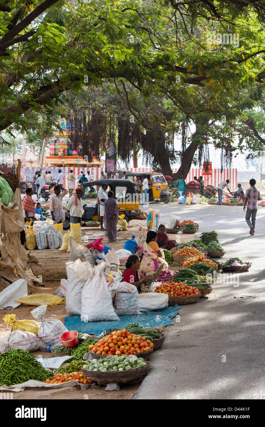 Indian street market in Yenumulapalli with baskets of vegetables ...