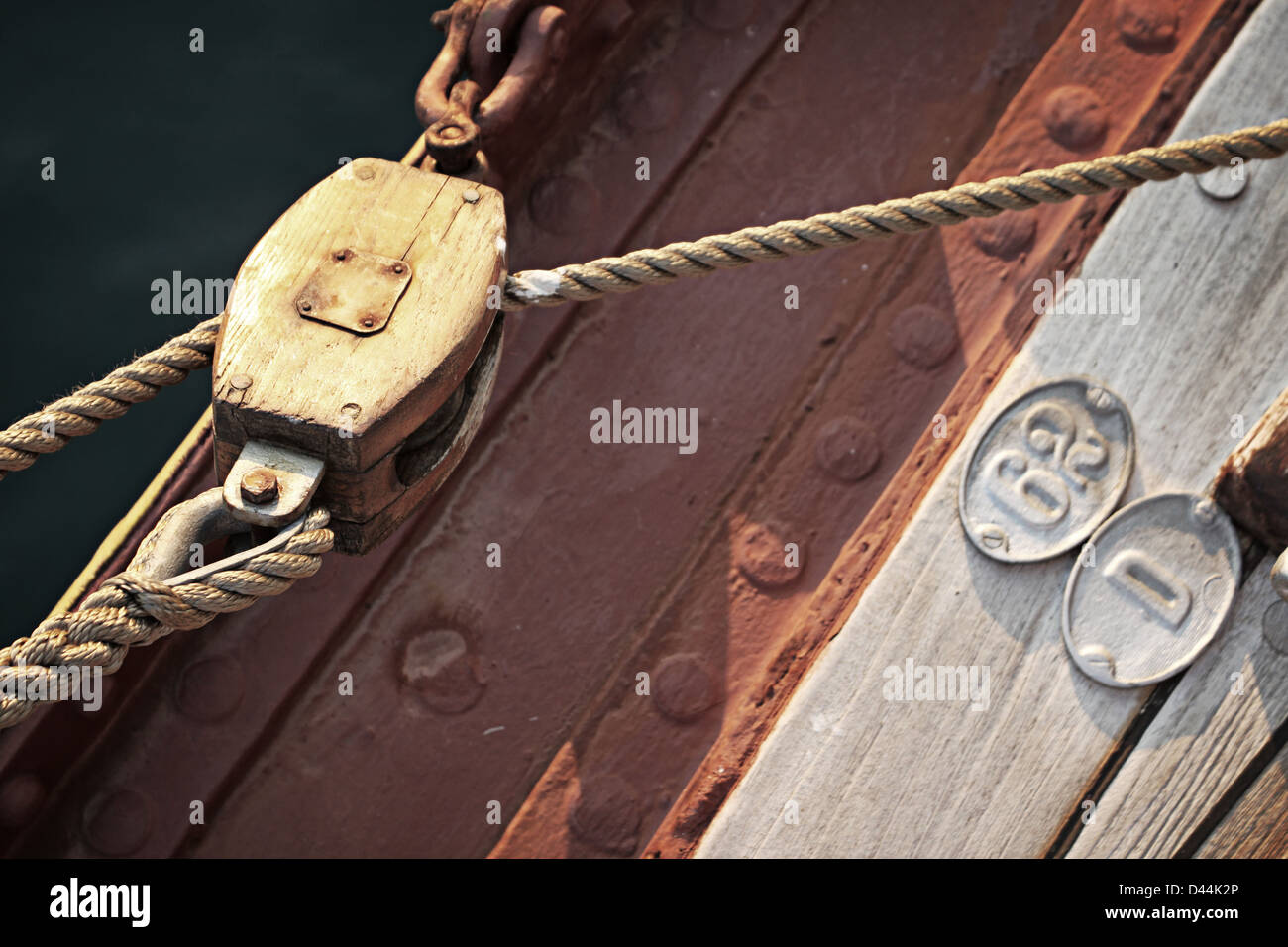 Rope boat vintage wooden pulley on old vessel Stock Photo - Alamy