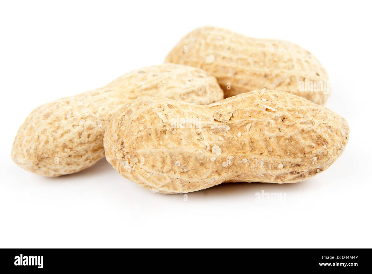 Close-up few peanuts isolated on a white background Stock Photo - Alamy