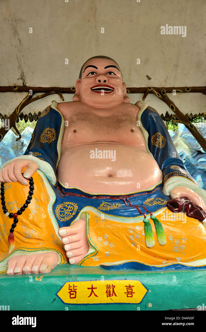 Laughing seated fat Buddhist monk Stock Photo - Alamy
