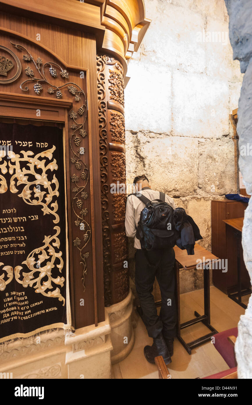 Jerusalem, Israel. A soldier praying in a small Synagogue located in ...