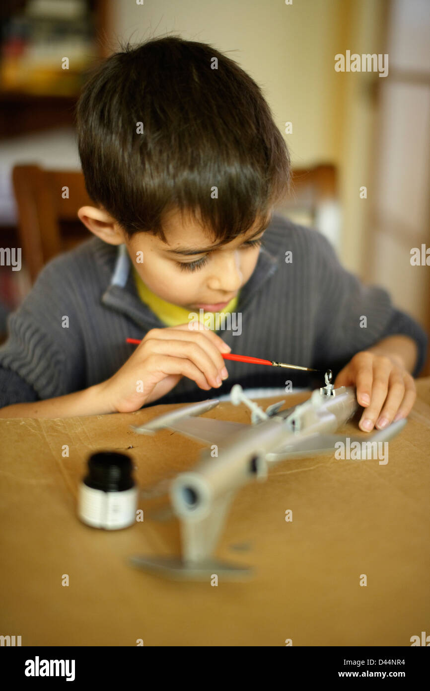 Child building model jet fighter hi-res stock photography and images ...