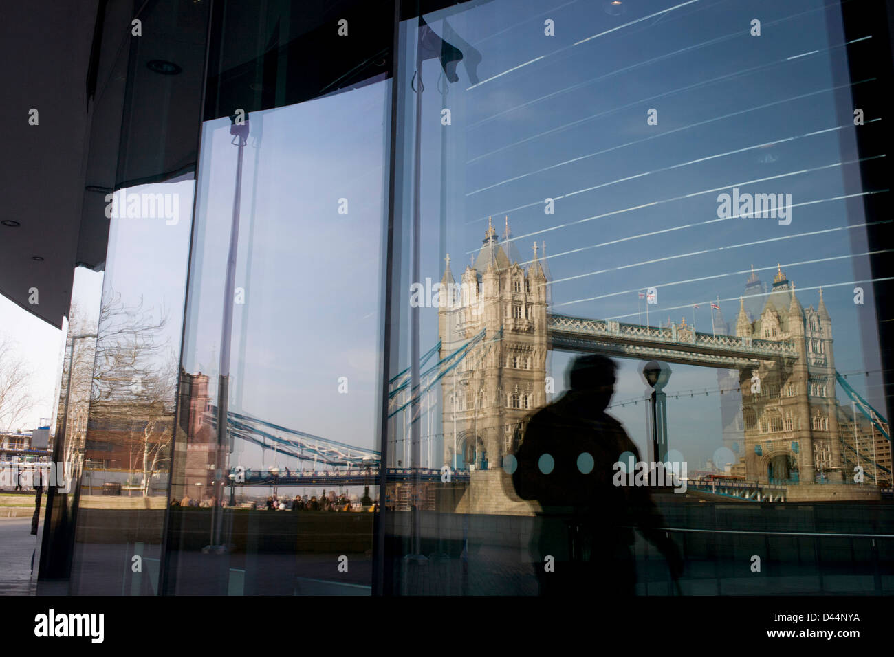 The Victorian Tower Bridge is seen reflected in the large glass windows ...