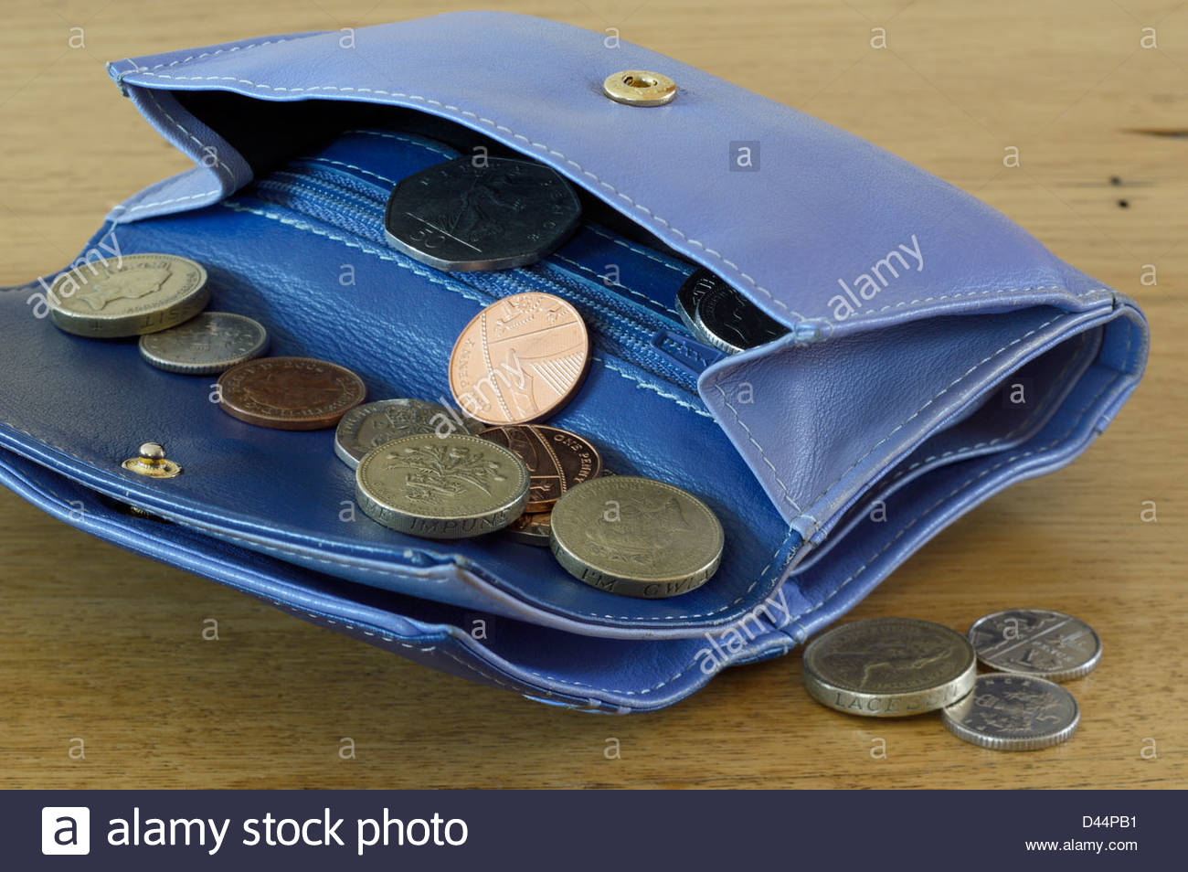 Money Falling Out Of Purse Stock Photos & Money Falling Out Of Purse ...