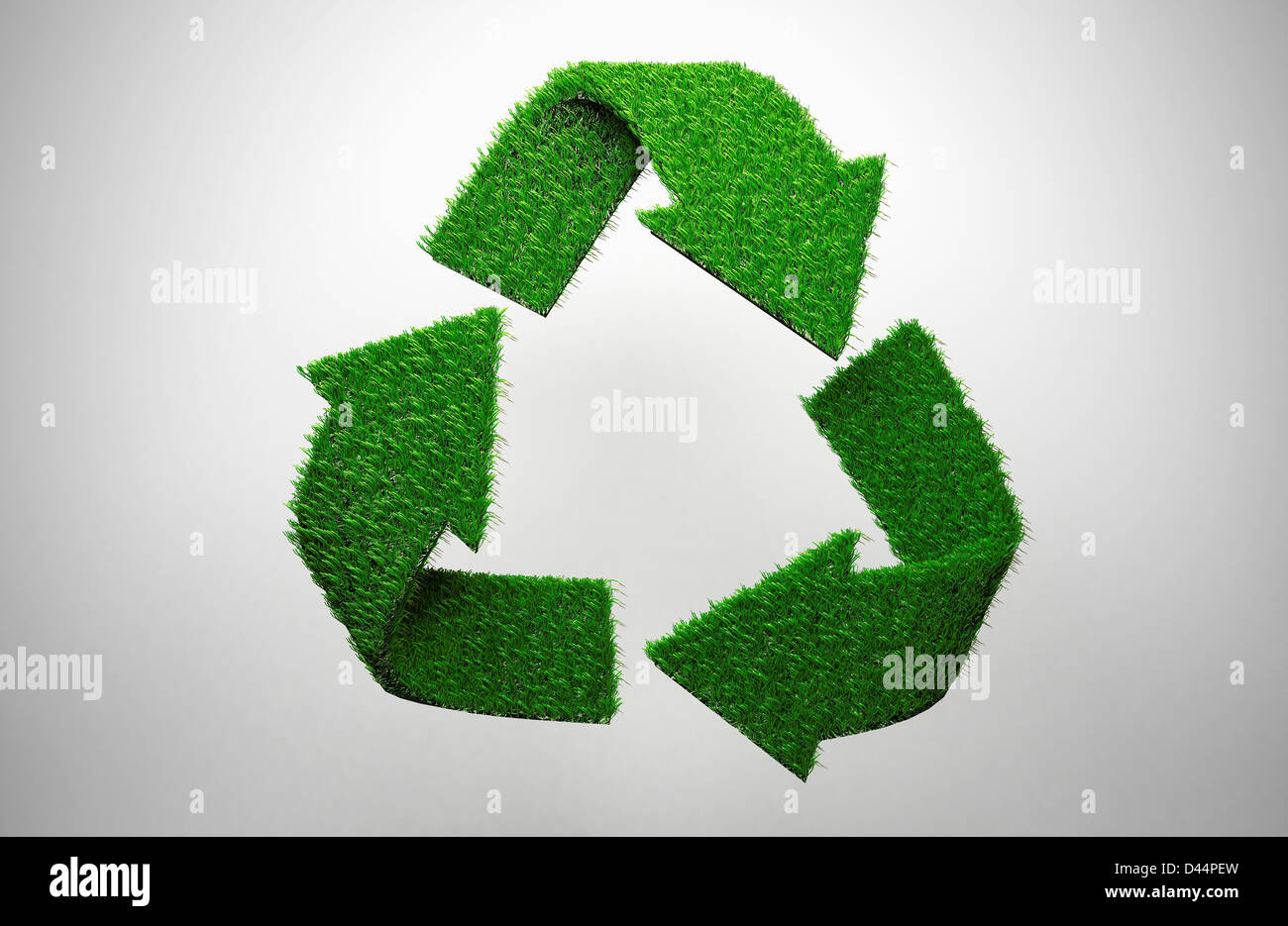 a recycling sign in grass Stock Photo - Alamy