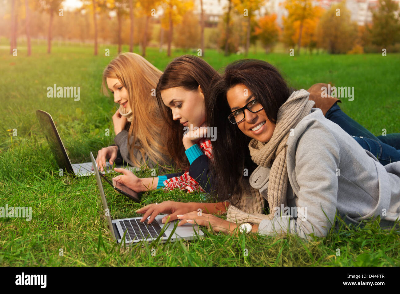 three students having fun during the lunch break Stock Photo - Alamy