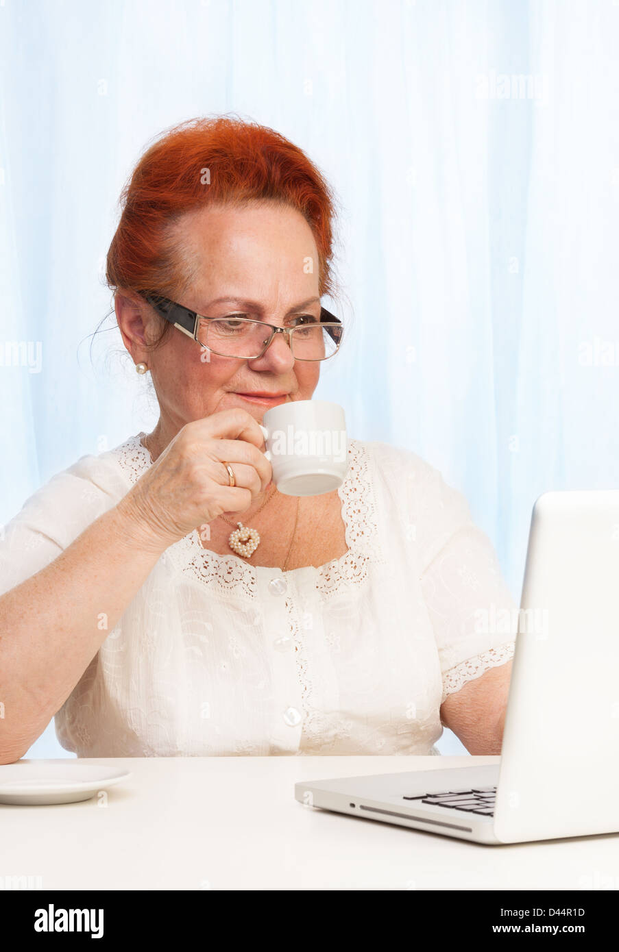 Drinking from cup woman reading hi-res stock photography and images - Alamy