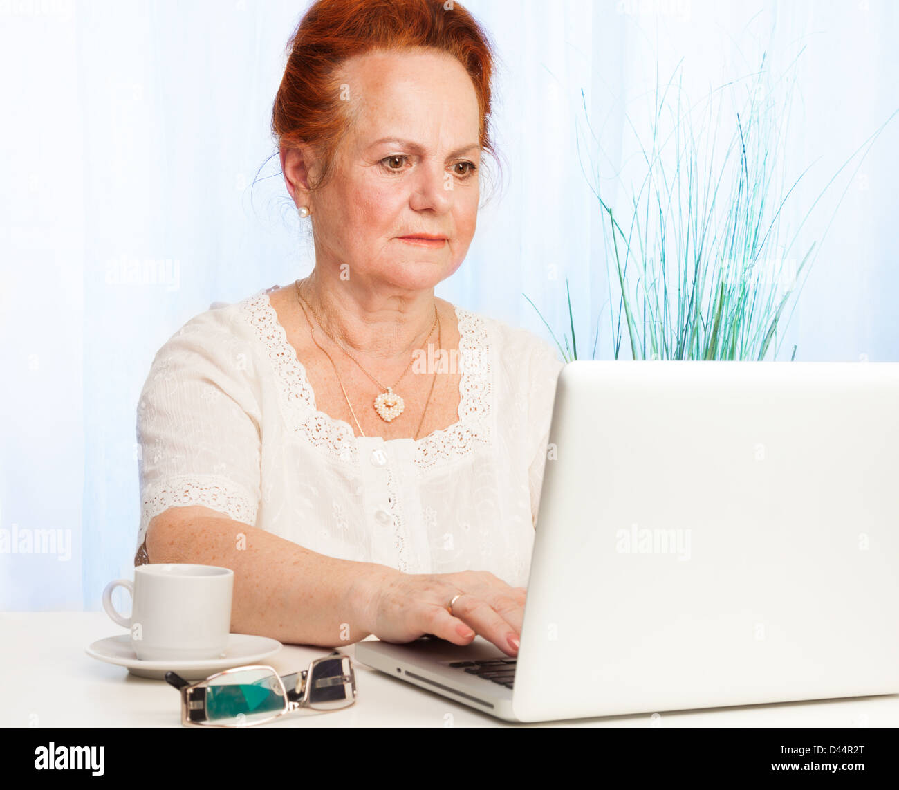 nice old lady with white laptop Stock Photo - Alamy