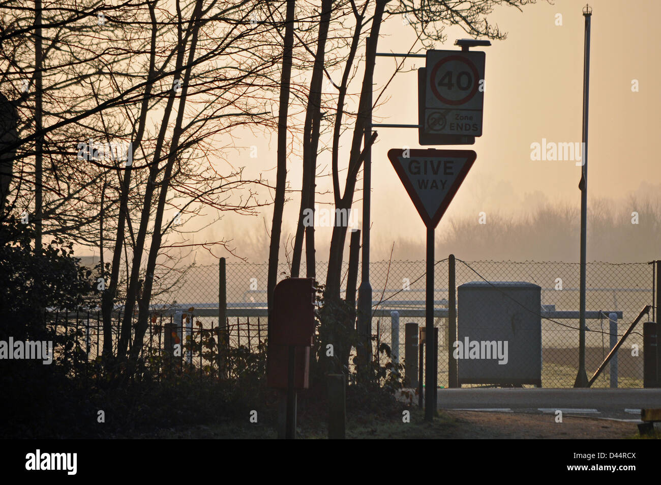 Road signs silhouetted near the side entrance to Ascot racecourse Stock ...