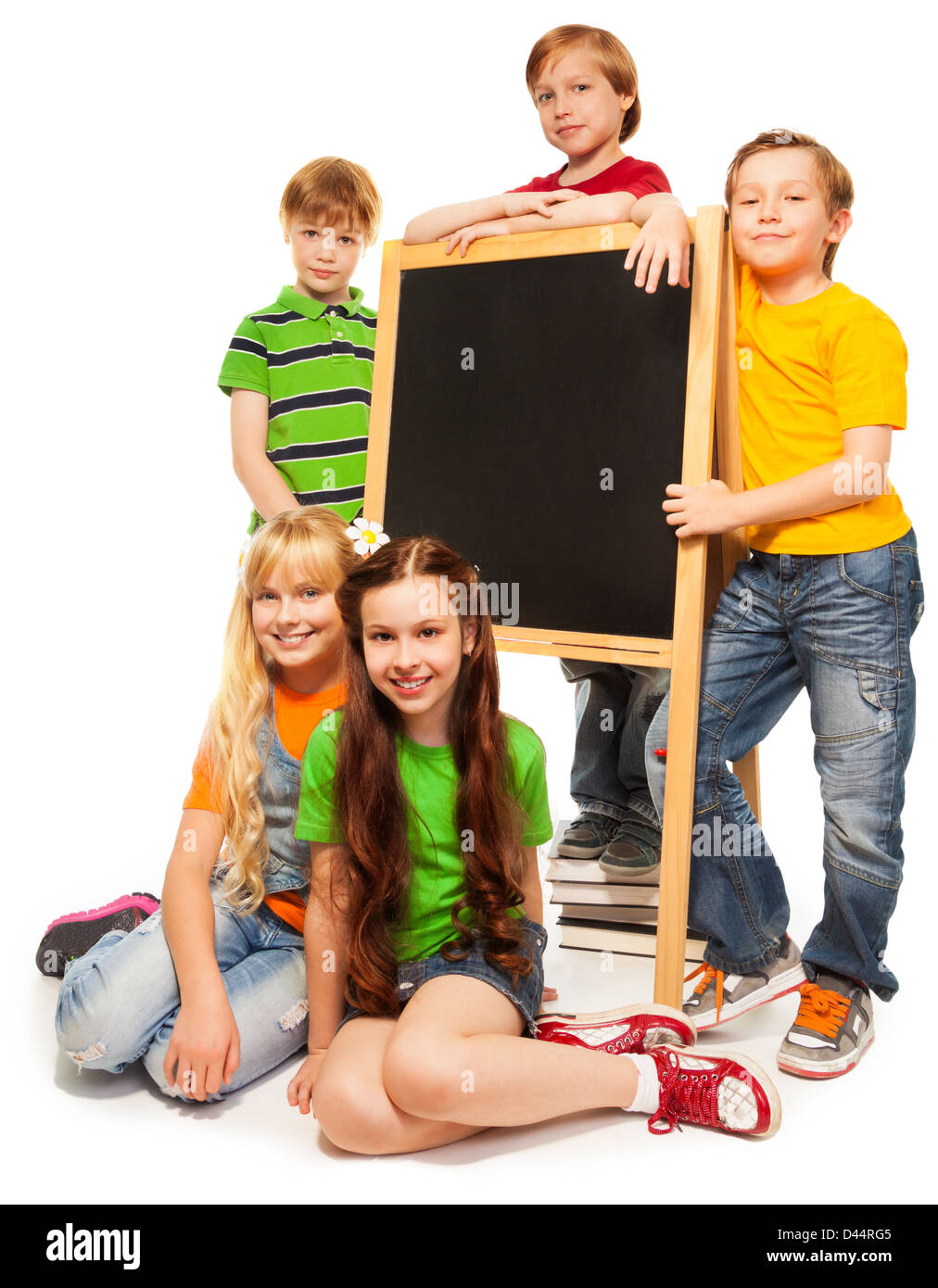Five cute school kids with blackboard isolated on white Stock Photo - Alamy
