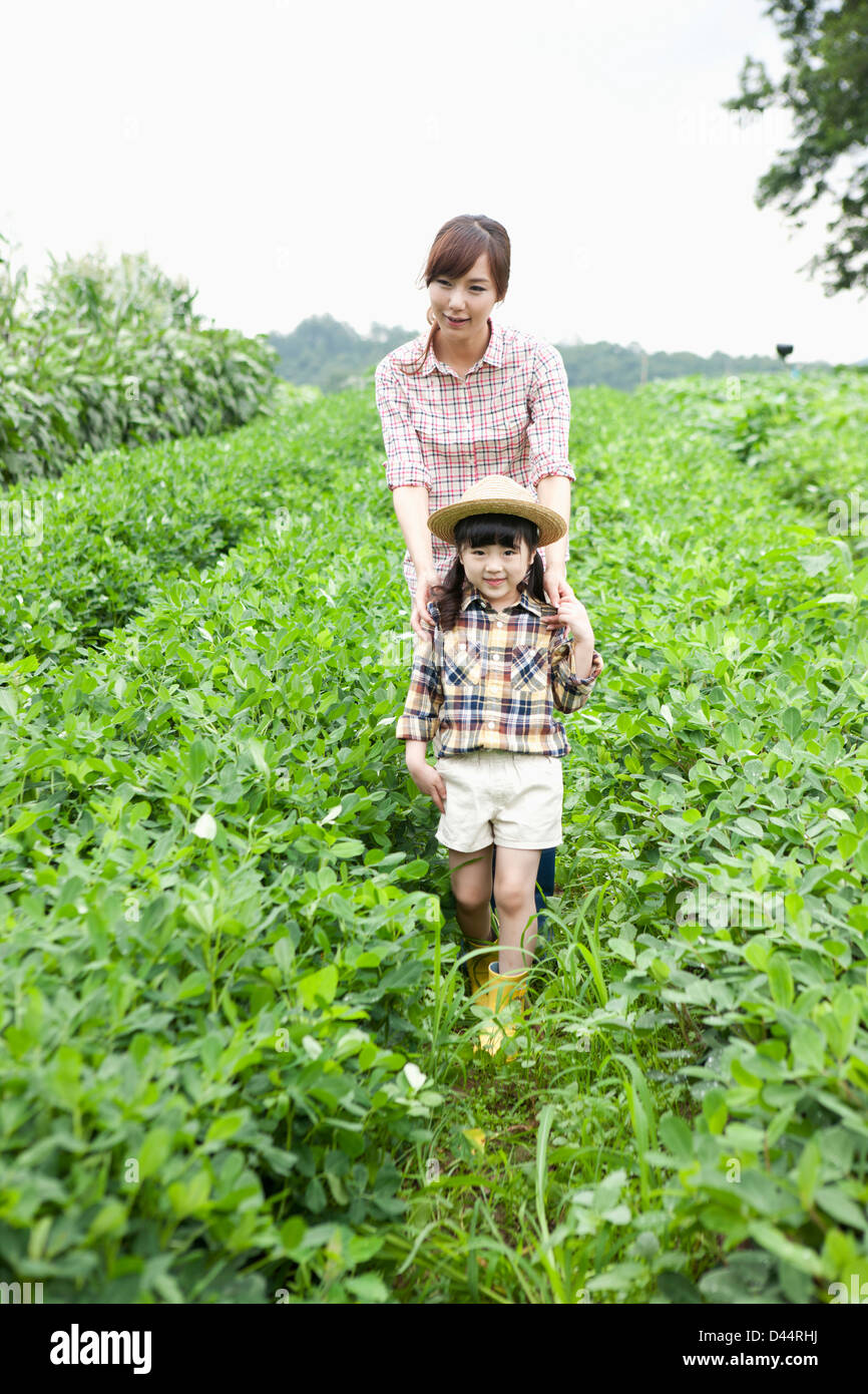a mother and a girl in a farm Stock Photo - Alamy