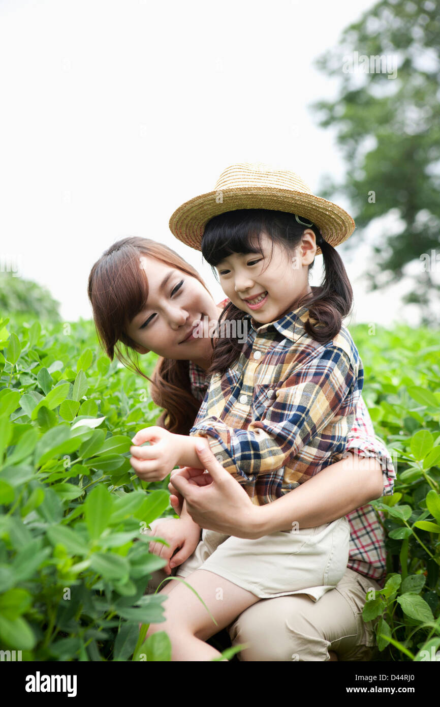 a mother and a girl in a farm Stock Photo - Alamy