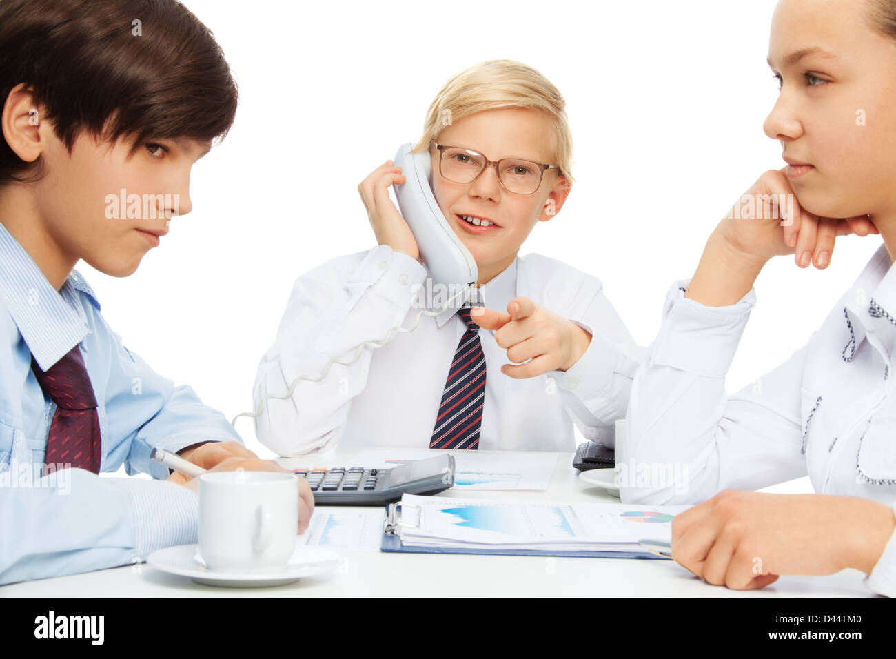 Confident bossy looking blond child pointing finger as he speaks on ...