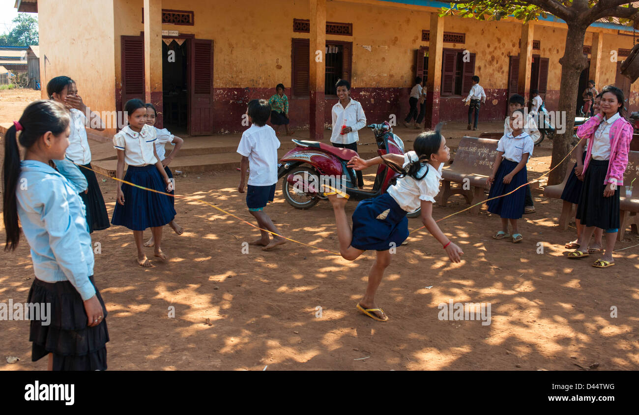 Cambodian girl students skipping between classes Stock Photo - Alamy