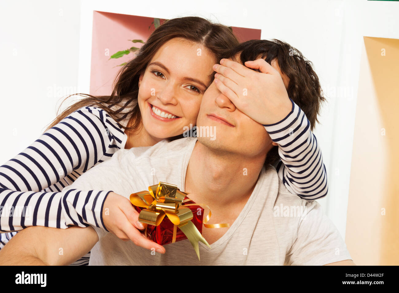 Present for him on the lovers Valentine's day, woman giving small ...