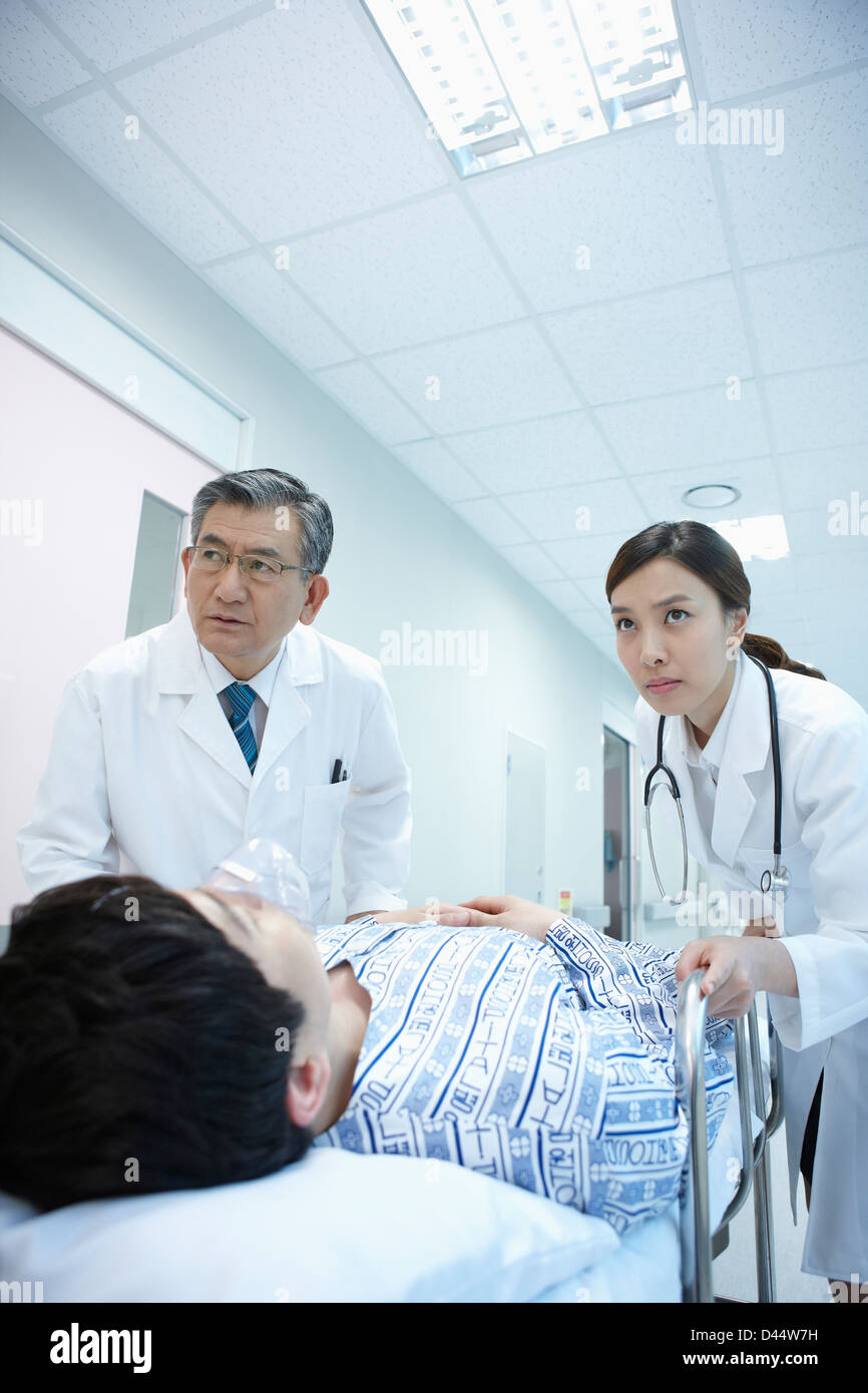 a patient lying on emergency bed in hospital Stock Photo - Alamy
