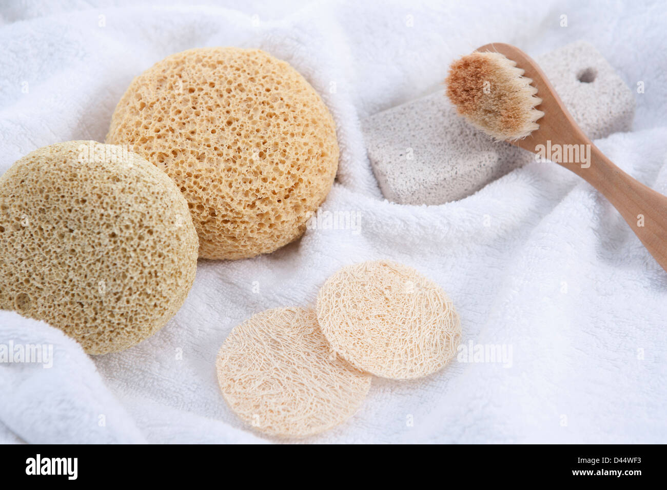 bathing sponge and soaps on a towel Stock Photo - Alamy