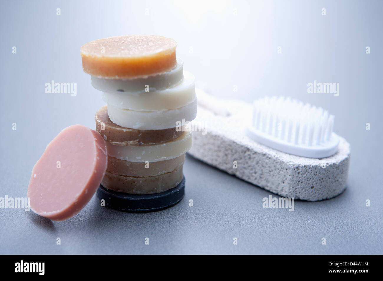 pile of soaps next to a brush Stock Photo - Alamy