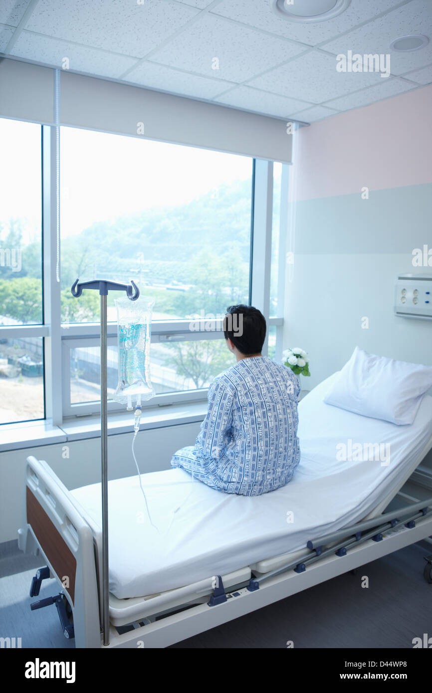 Back view patient man hospital bed hi-res stock photography and images ...