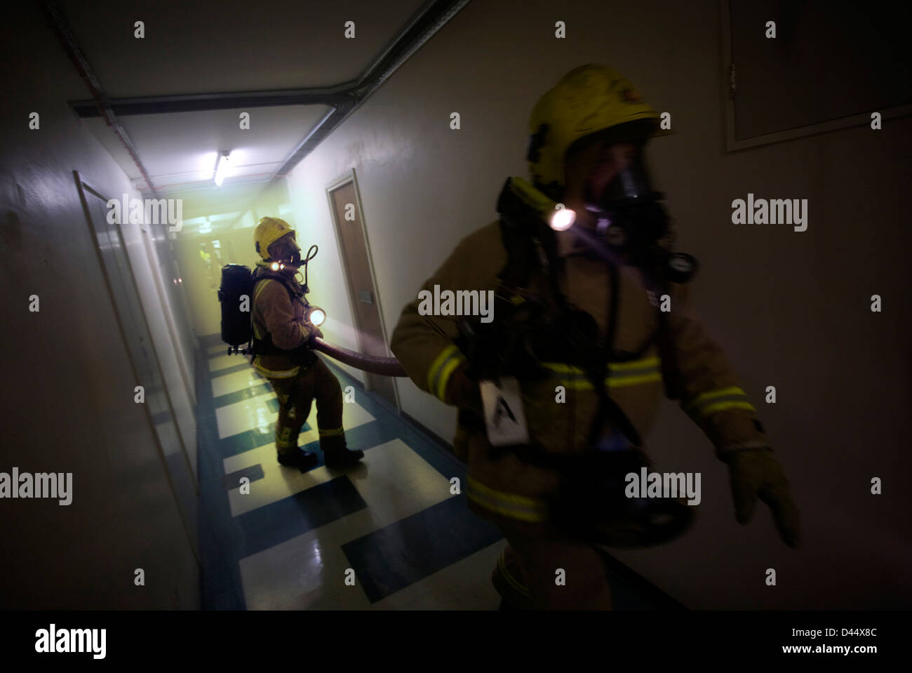 Kent Fire and Rescue service training exercise two fire fighters ...