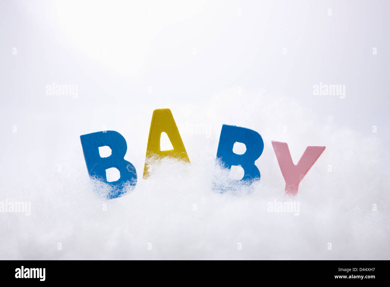 a word baby on white cotton Stock Photo - Alamy