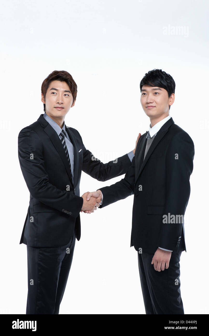 two businessmen shaking hands Stock Photo - Alamy
