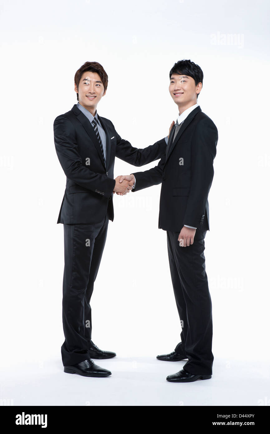 two businessmen shaking hands Stock Photo - Alamy