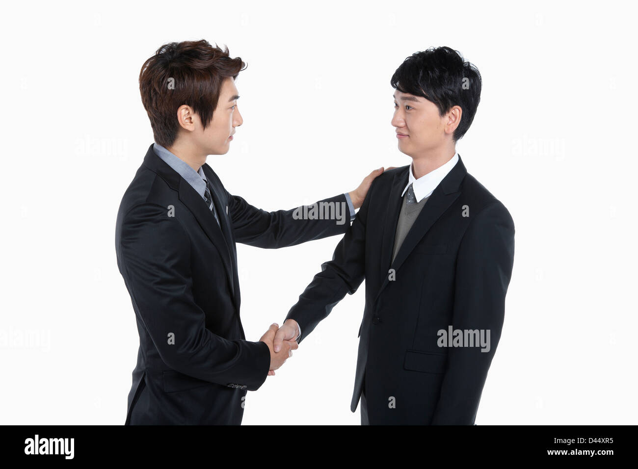 two businessmen shaking hands Stock Photo - Alamy