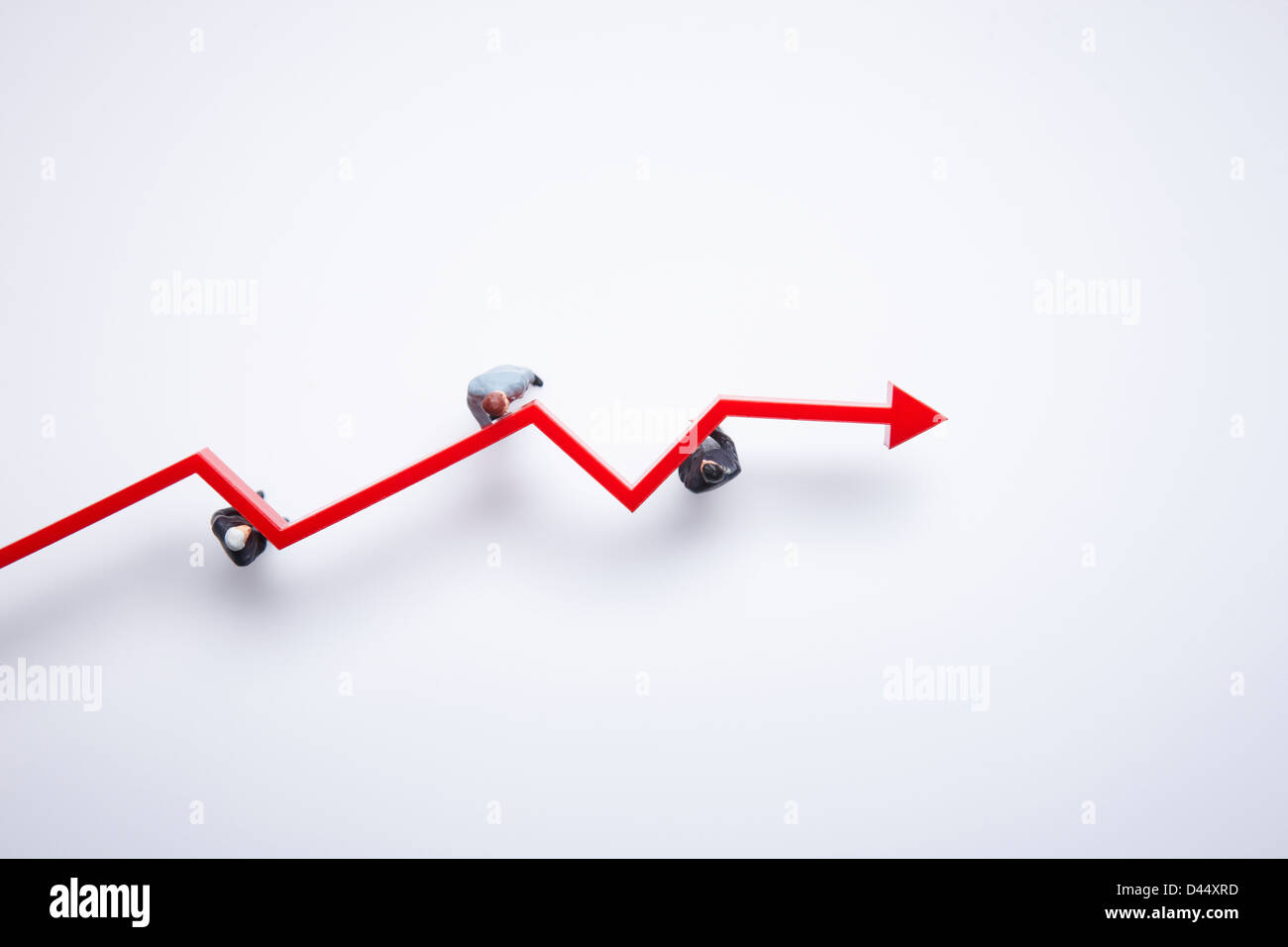 a zigzag arrow between businessmen Stock Photo - Alamy