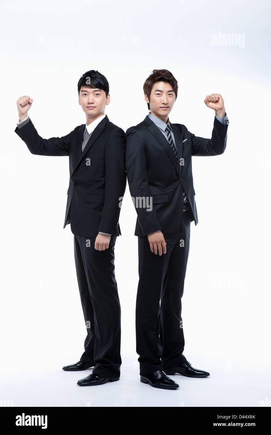 two businessmen with cheering pose Stock Photo - Alamy