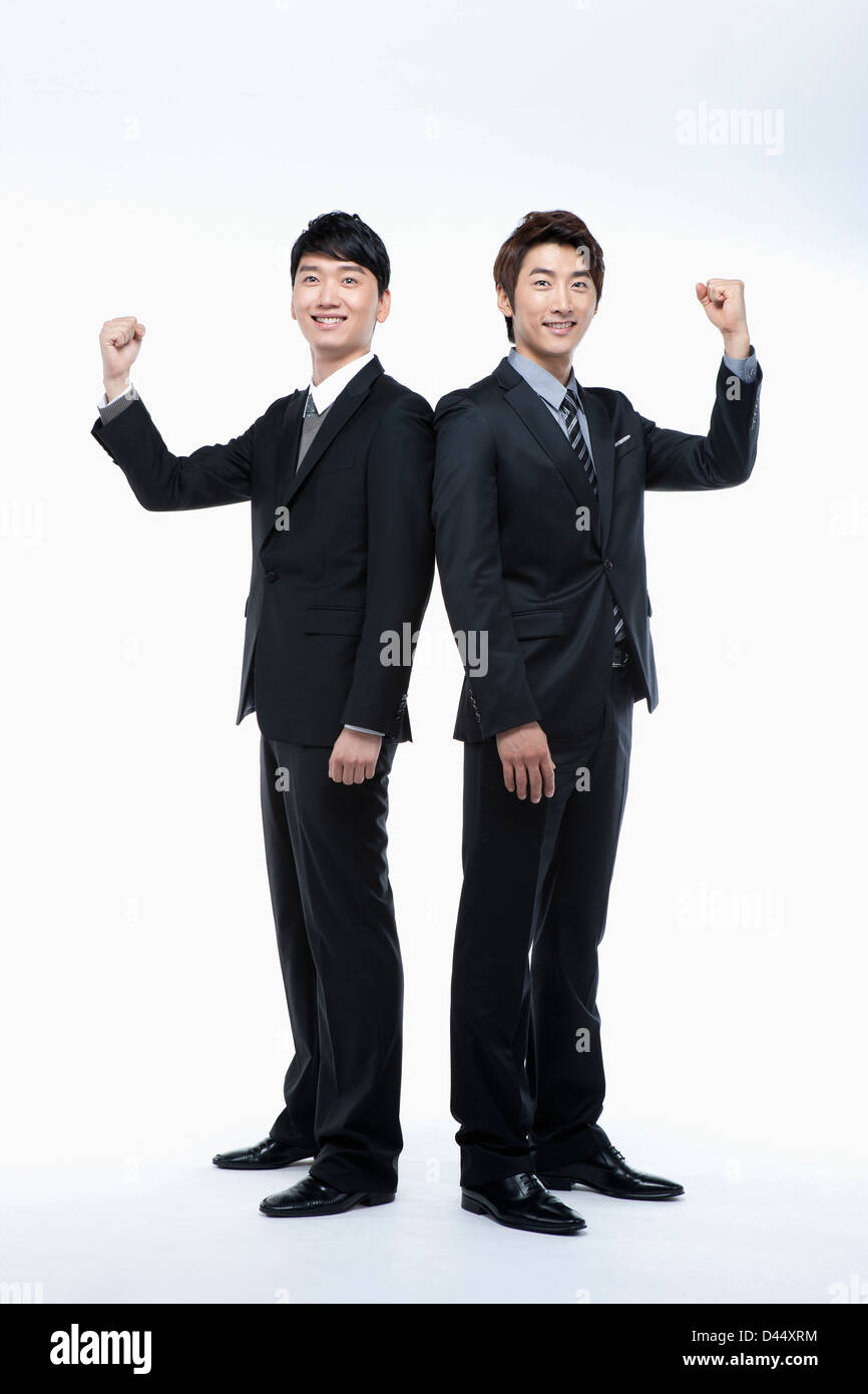 two businessmen with cheering pose Stock Photo - Alamy