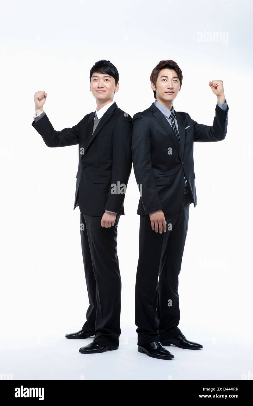 two businessmen with cheering pose Stock Photo - Alamy
