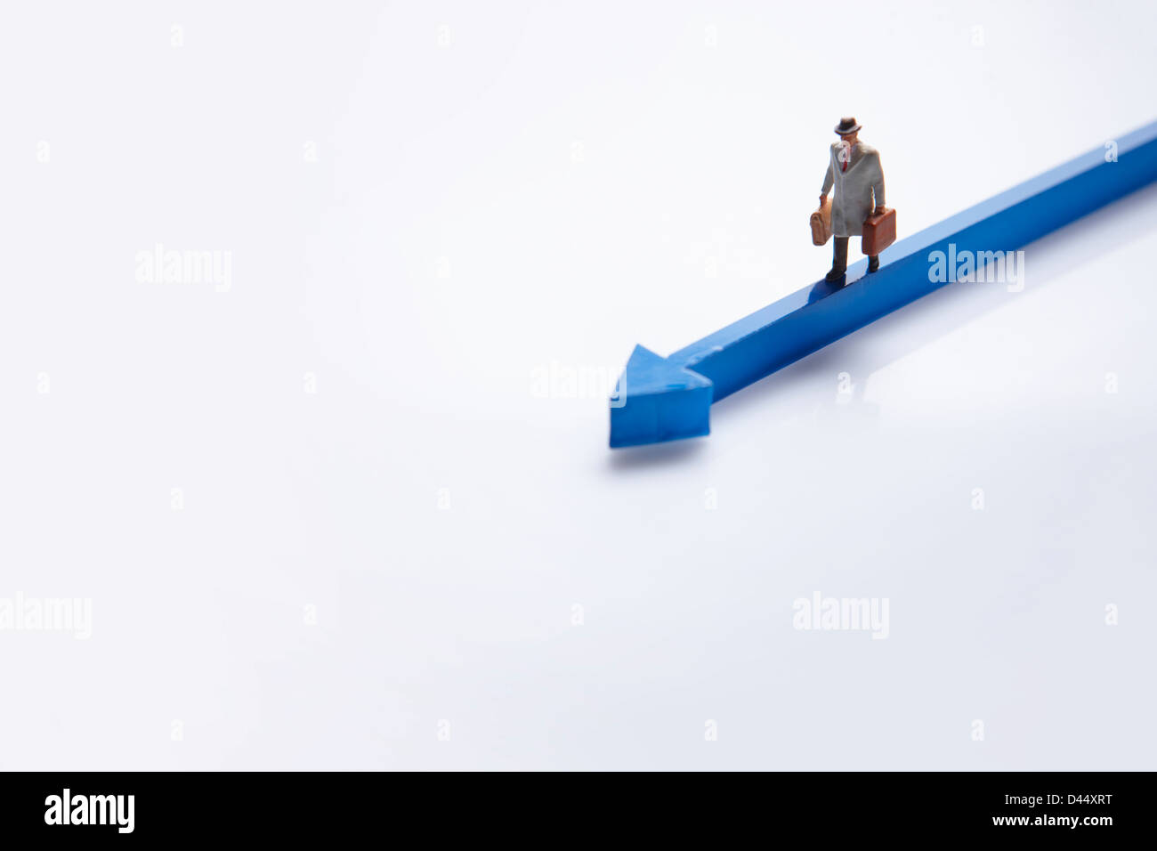 a man walking on a blue arrow Stock Photo - Alamy