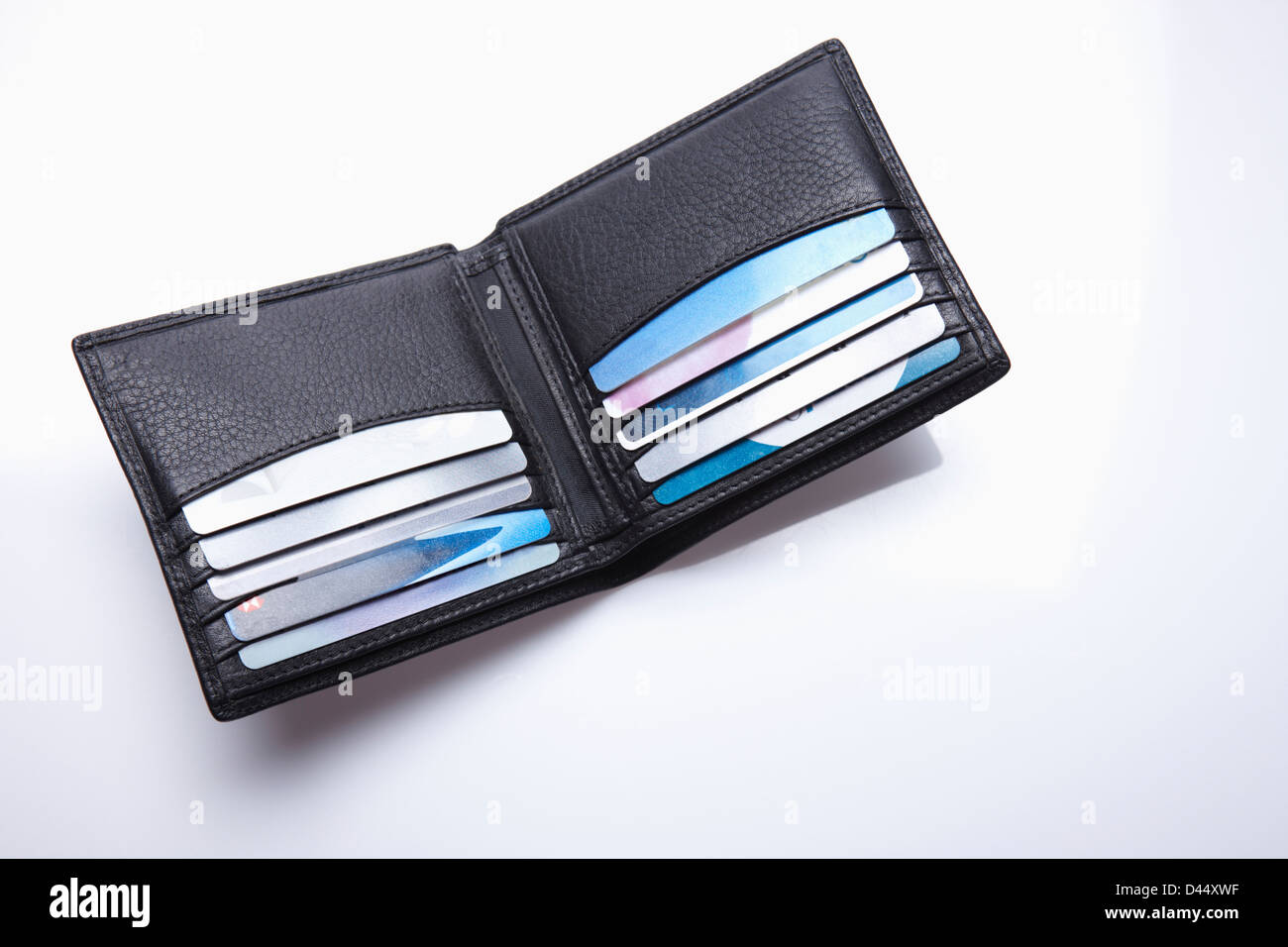 a wallet filled with cards Stock Photo - Alamy