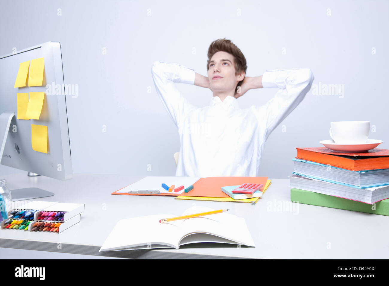 a man having a rest on a desk Stock Photo - Alamy