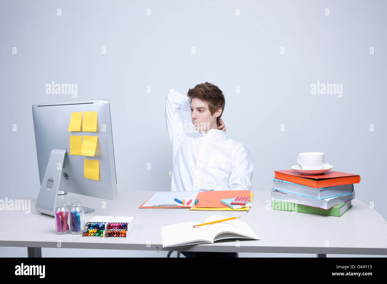 a man having a rest on a desk Stock Photo - Alamy